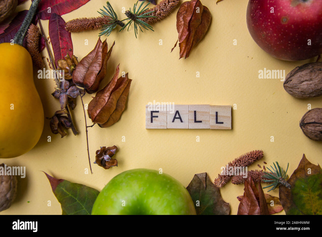 Text spelt with wooden letter tiles on pale yellow background, word ...