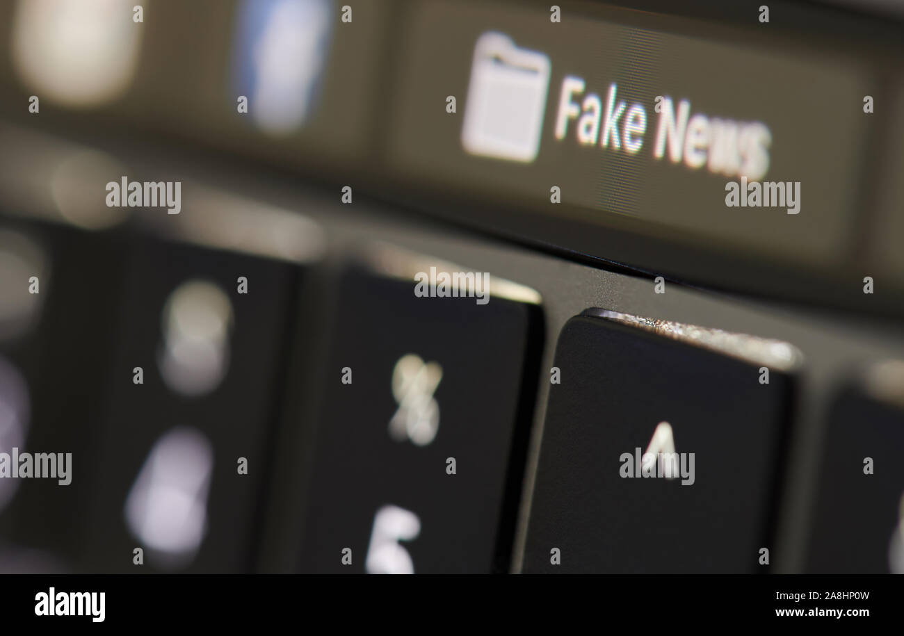 Close up of fake news folder on laptop screen Stock Photo - Alamy