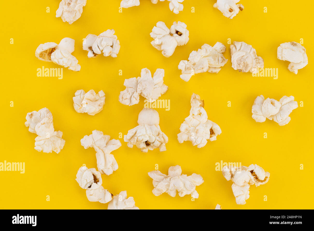 Popcorn pattern on yellow background. Top view Stock Photo - Alamy