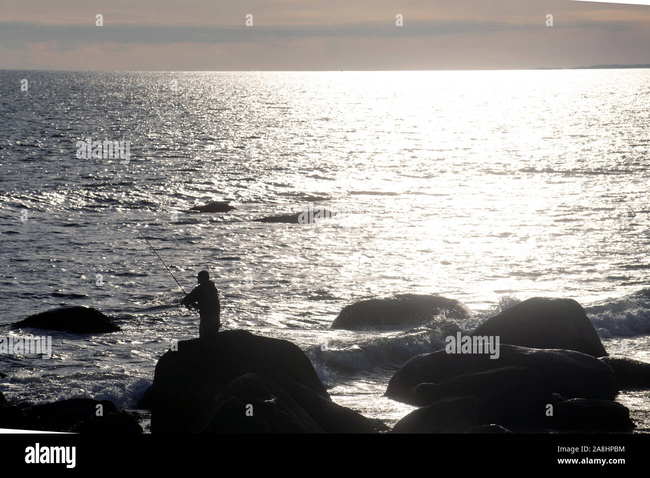 Fisherman on coastal rocks hi-res stock photography and images - Alamy