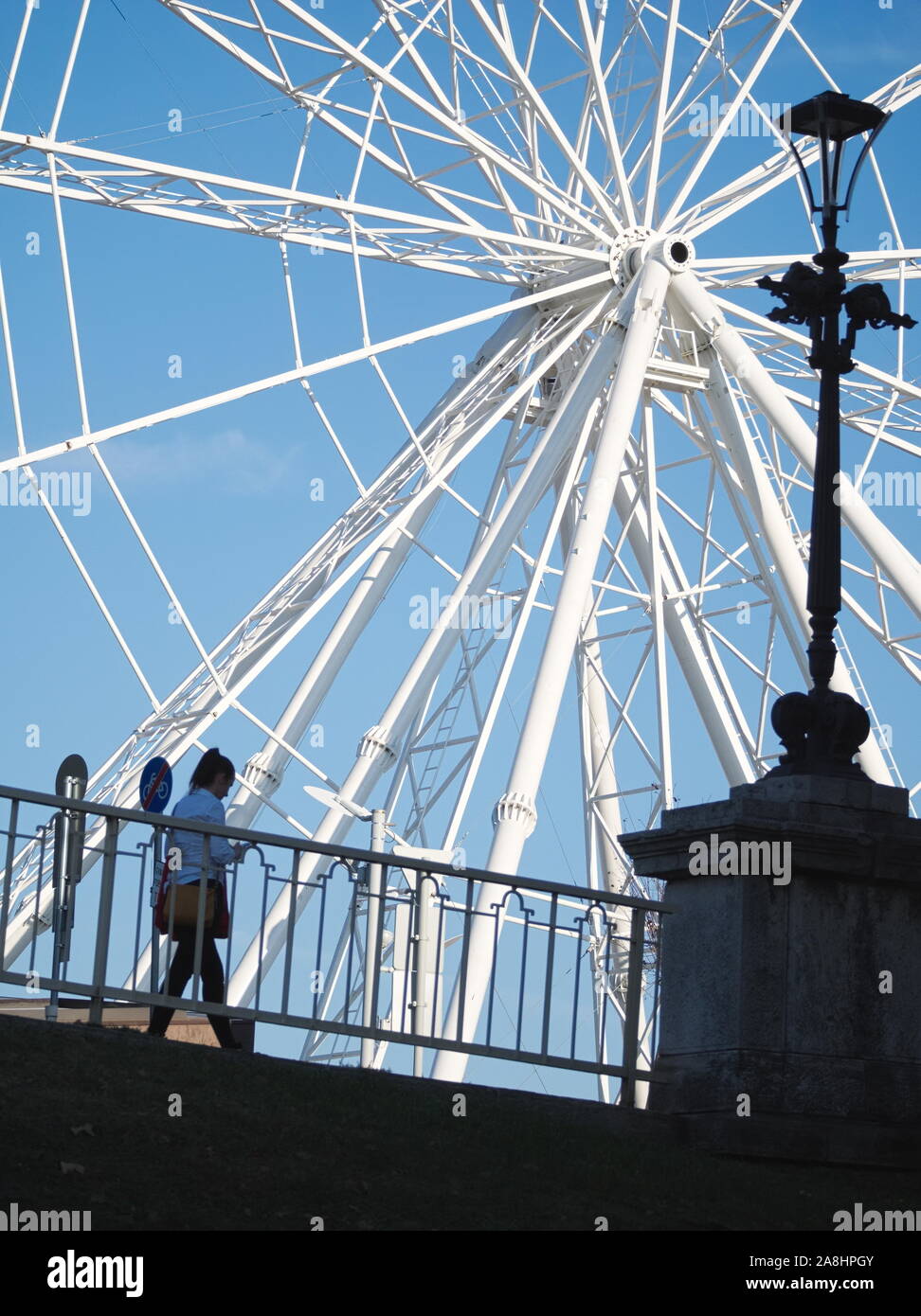 Woman Walking on Kossuth Bridge before Ferris Wheel in Győr, Hungary ...
