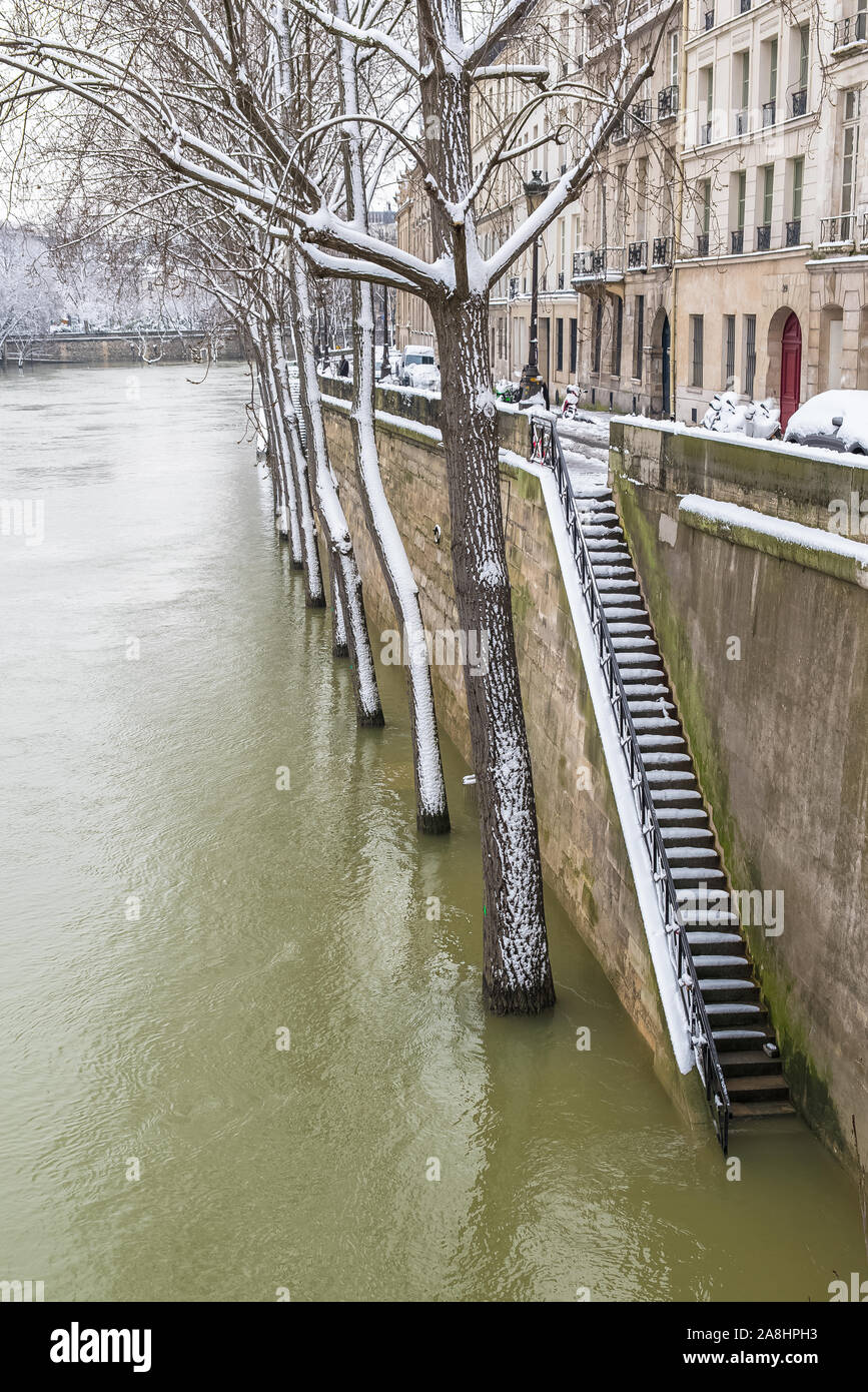 Paris under the snow and floods, snowman on the bank of the Seine ...