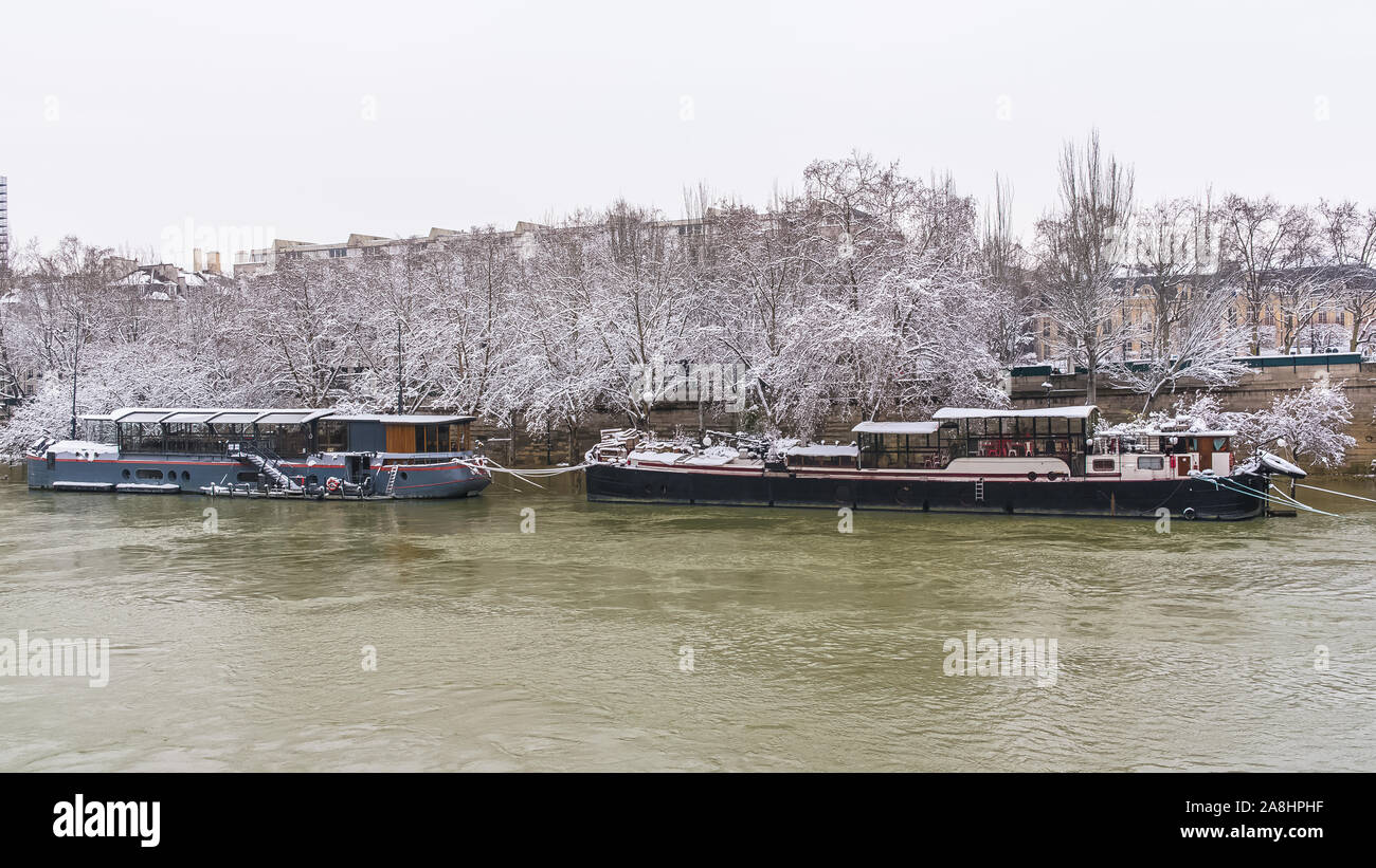 Paris under the snow and floods, snowman on the bank of the Seine ...