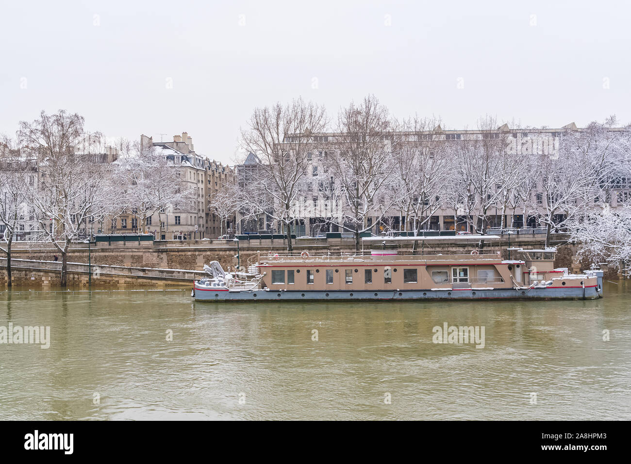 Paris under the snow and floods, snowman on the bank of the Seine ...