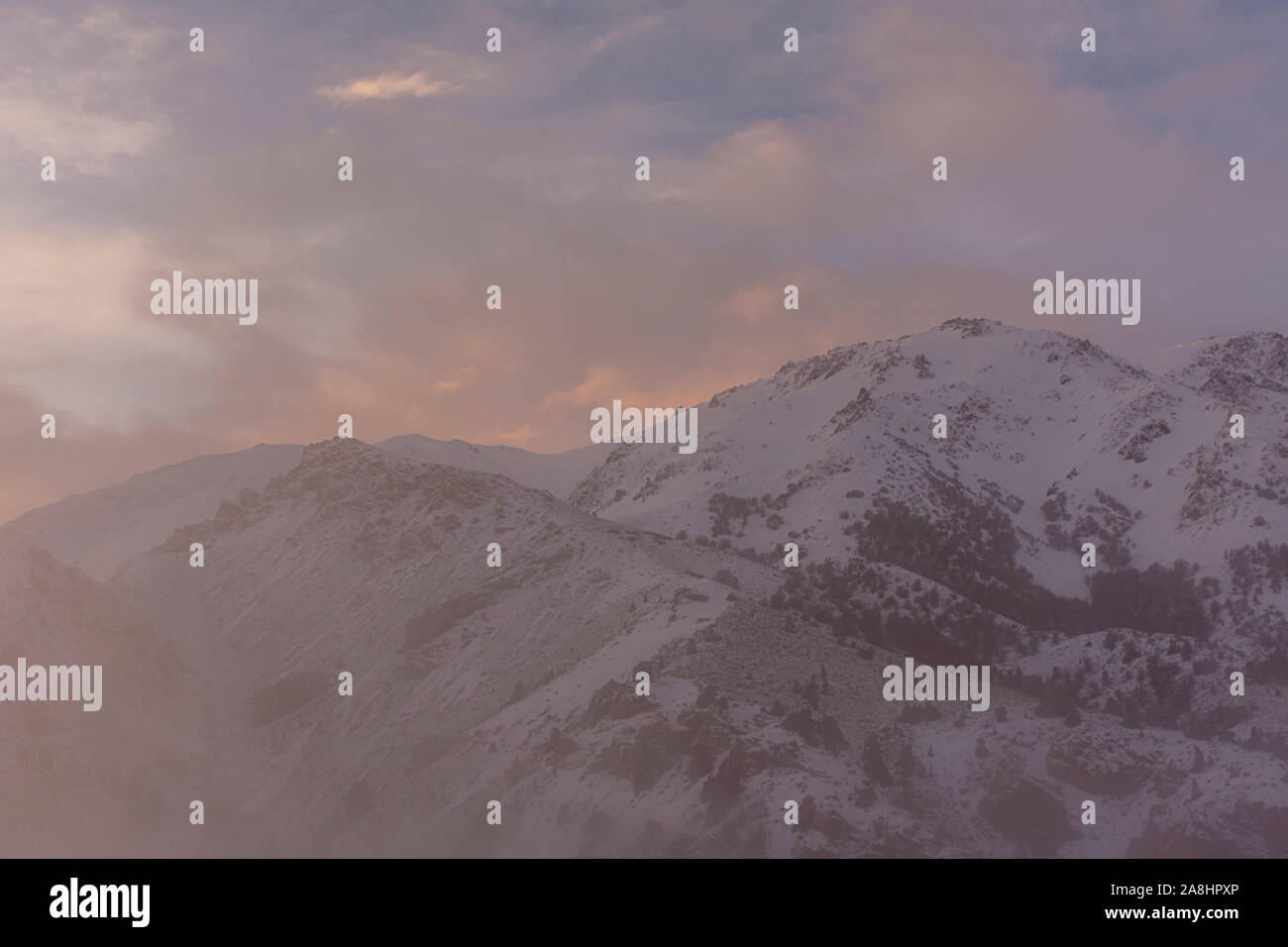 Winter sunset in the Andes mountains with fog in the valley Stock Photo ...