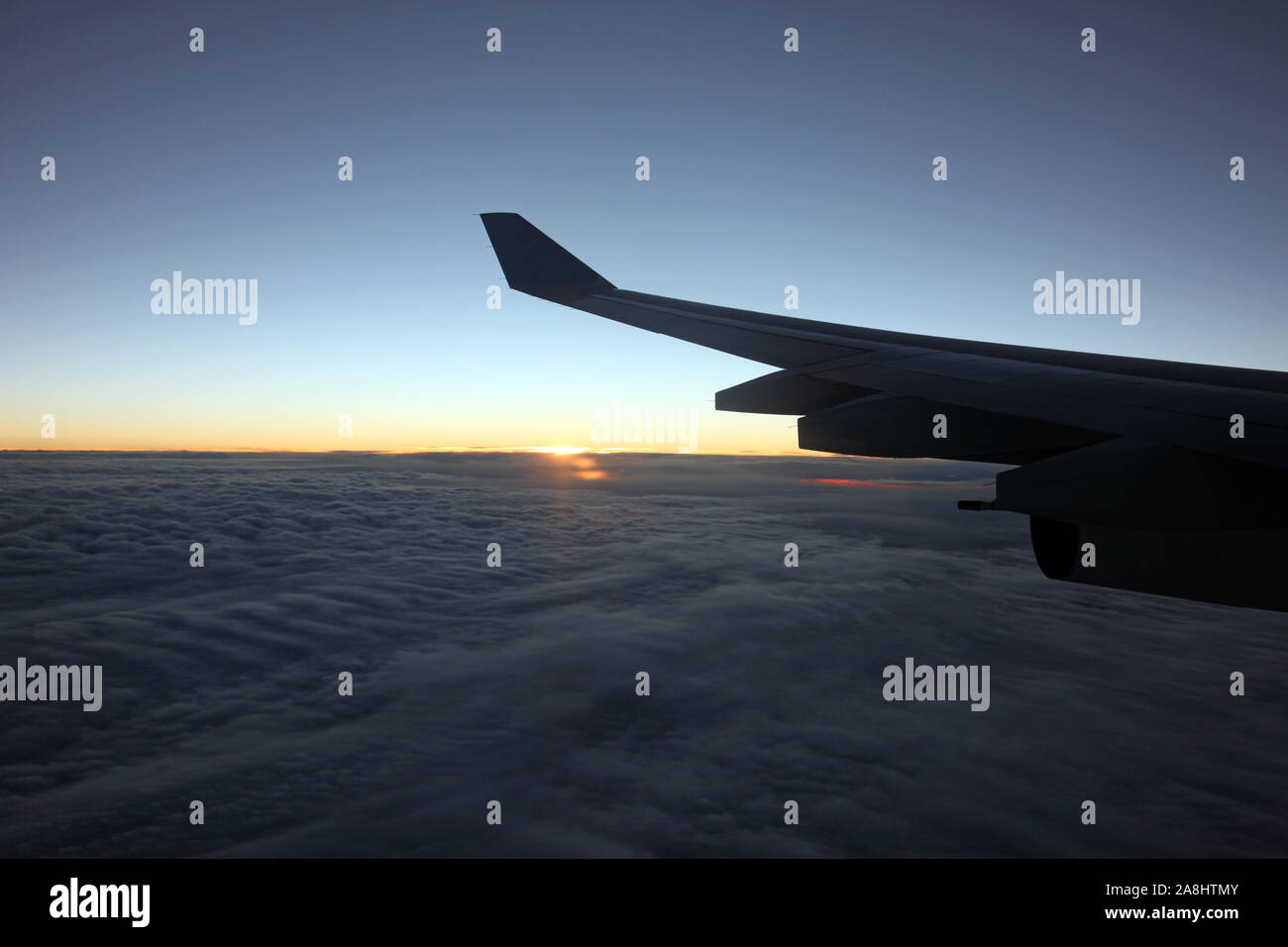 Wing of airplane from window Stock Photo - Alamy