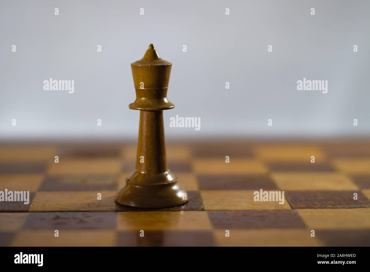 White queen chess piece on a chess board Stock Photo - Alamy
