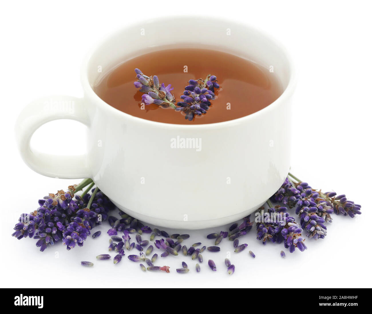Lavender tea with flower over white background Stock Photo - Alamy