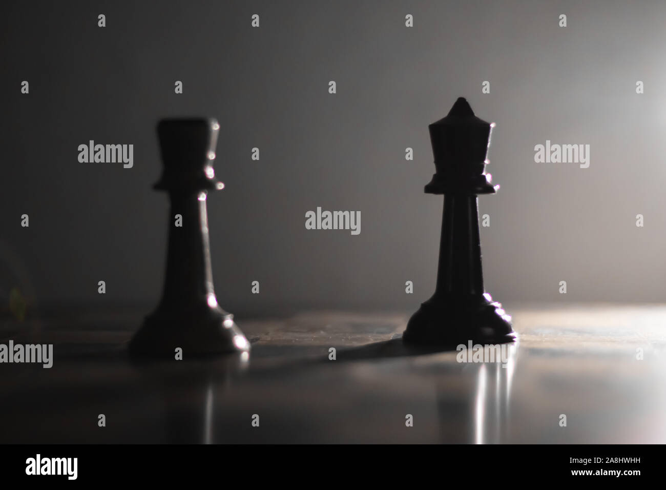 King and queen chess pieces on a chessboard hi-res stock photography ...