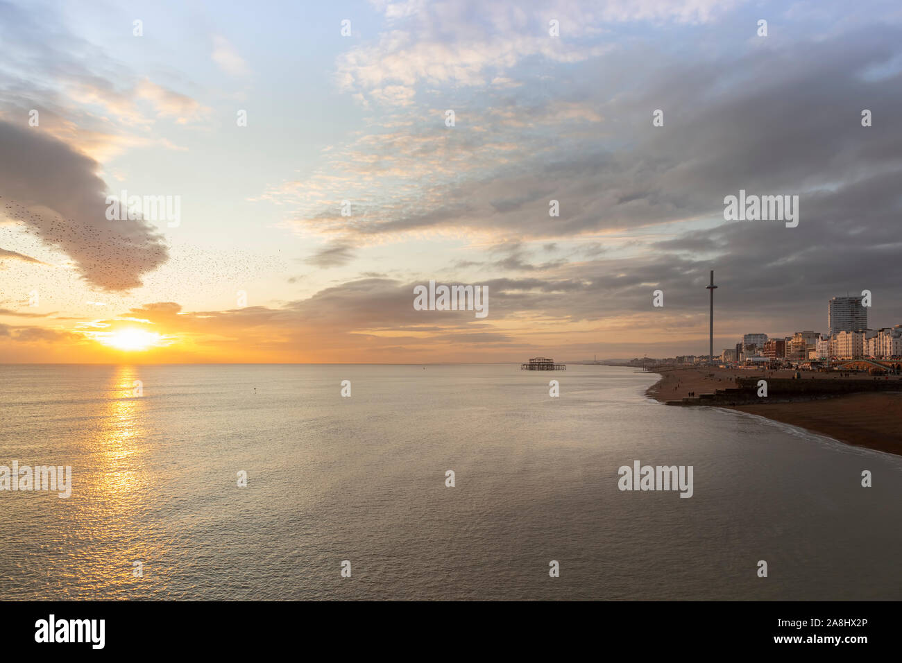 sunset lighting up brighton seafront buildings Stock Photo - Alamy