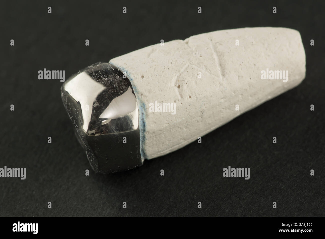 Dental metal tooth crowns isolated on white background Stock Photo - Alamy