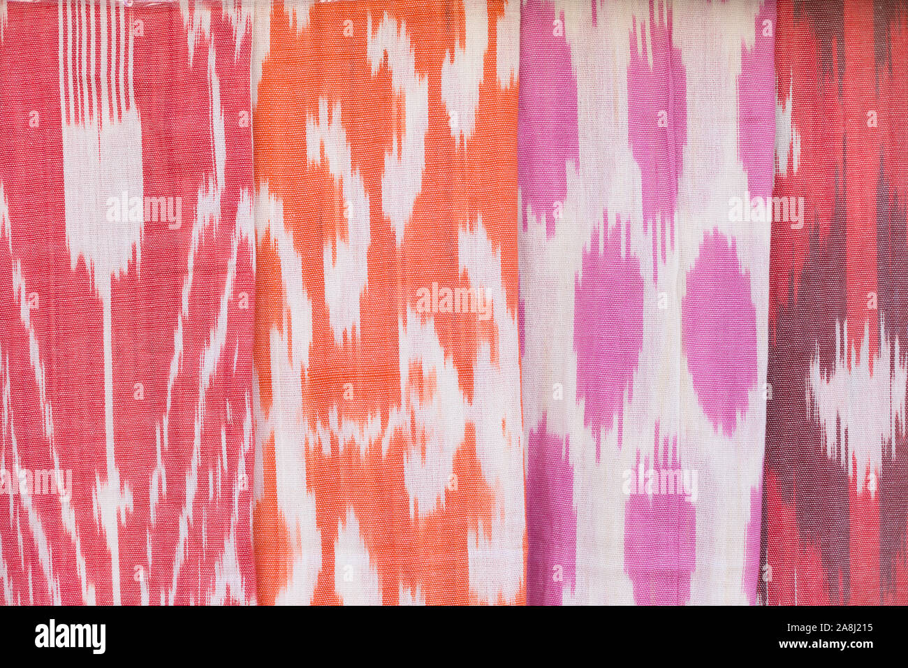 Woven traditional ikat fabrics Stock Photo - Alamy