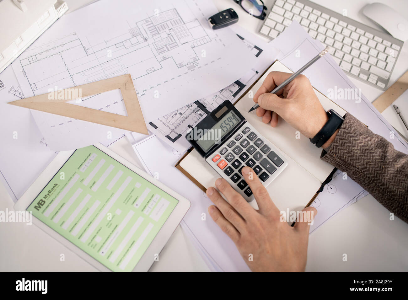 Hand with calculator hi-res stock photography and images - Alamy