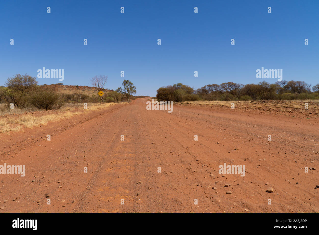 a dry path of sand in the australian outback ends in the desert Stock ...