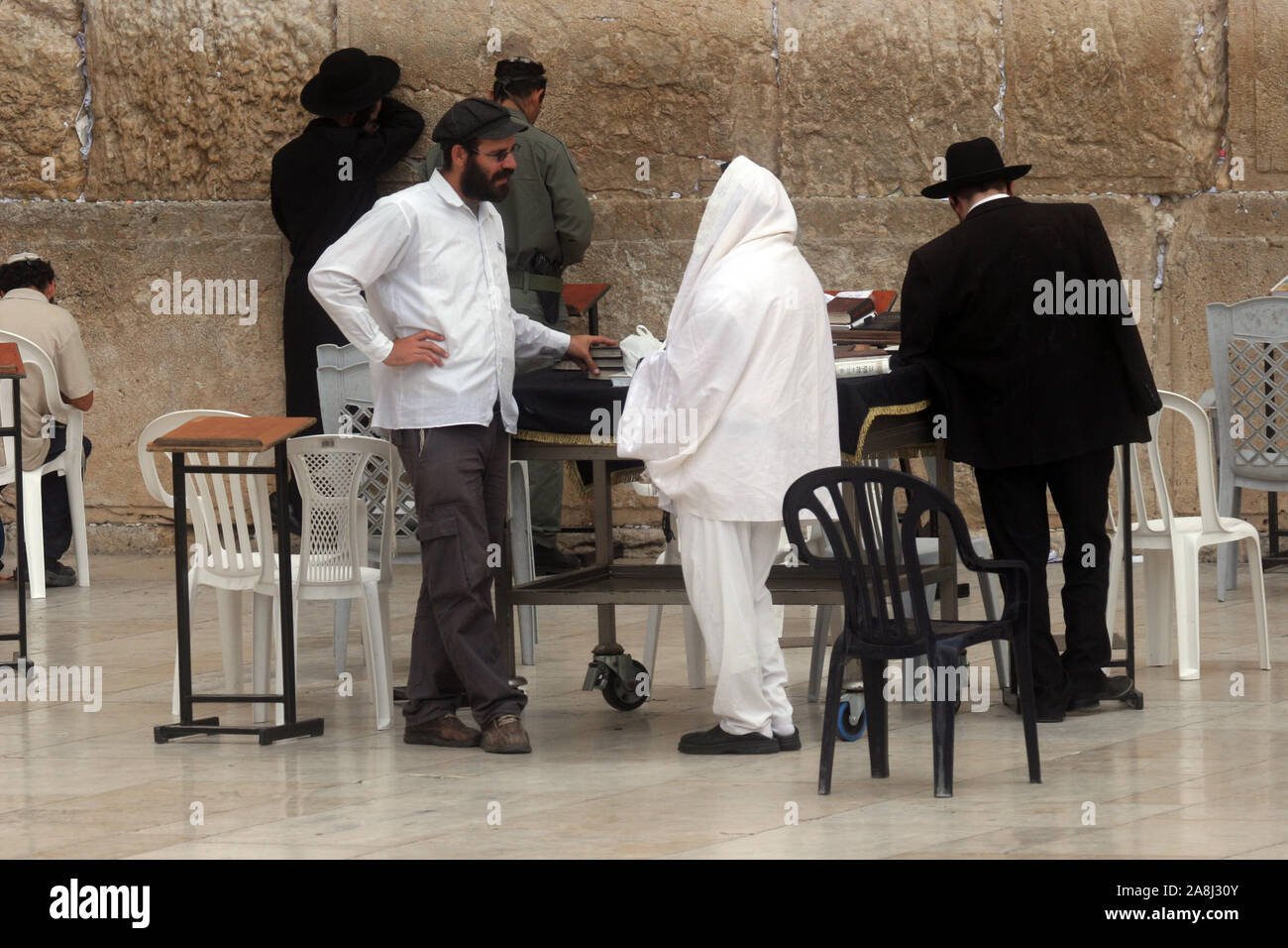 Jewish men pray at the western wall in Jerusalem, IL. The wall is one ...