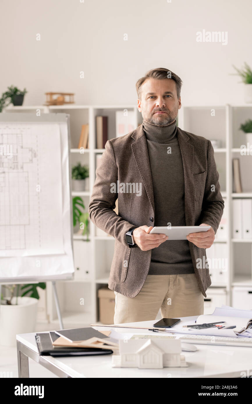 Mature architect using digital hi-res stock photography and images - Alamy