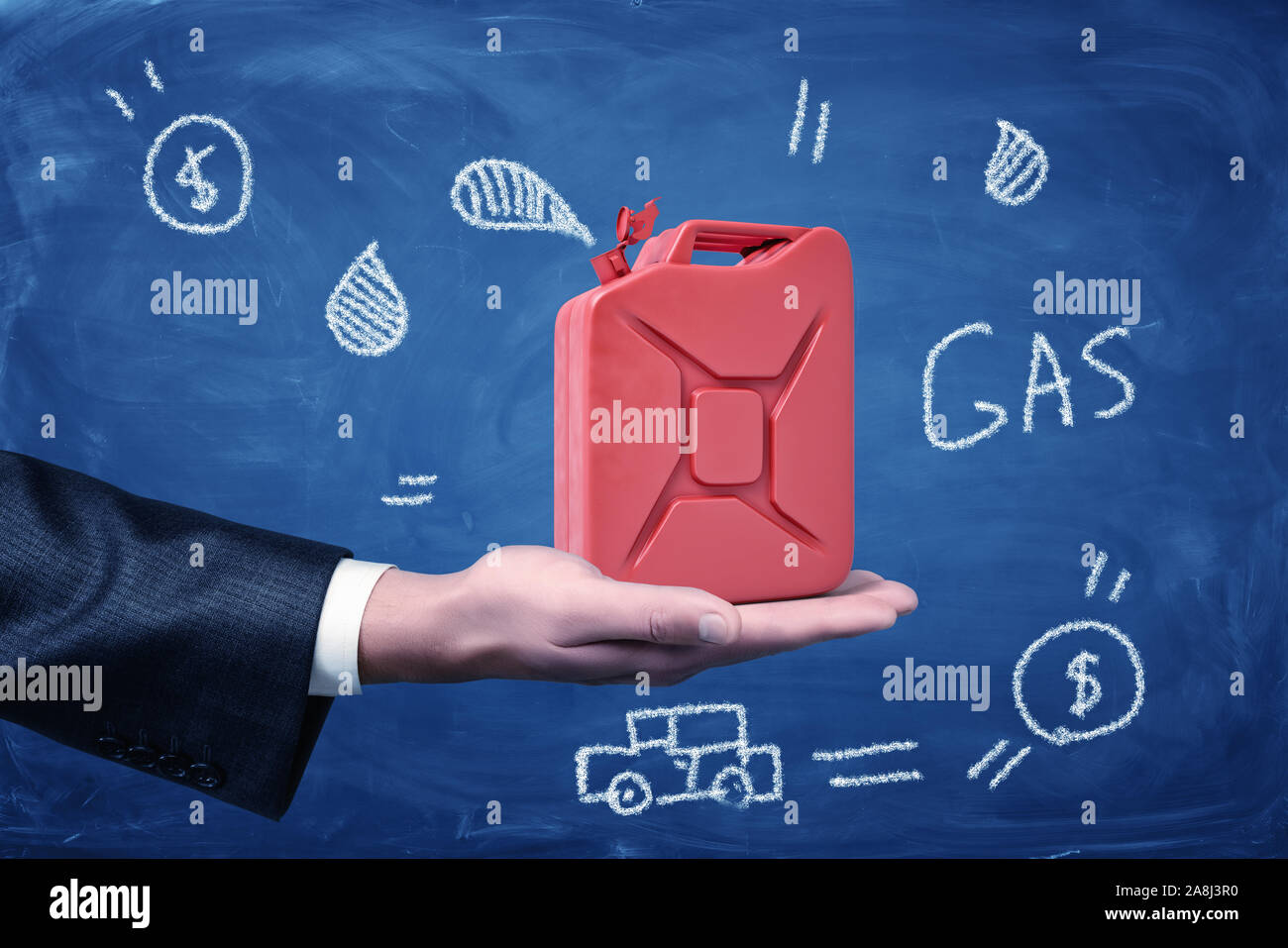 Male hand holding red gasoline can with cartoon drawings on blue ...