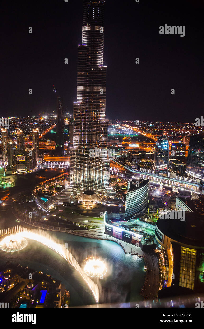 Amazing aerial night view of the Burj Khalifa tower and the dancing ...