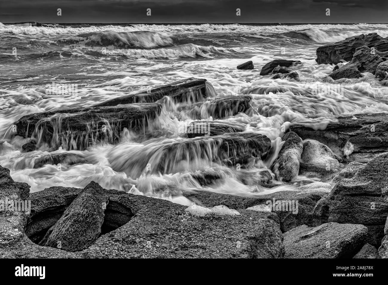 High Tide on a Rocky Beach in Palm Coast, Florida Stock Photo - Alamy
