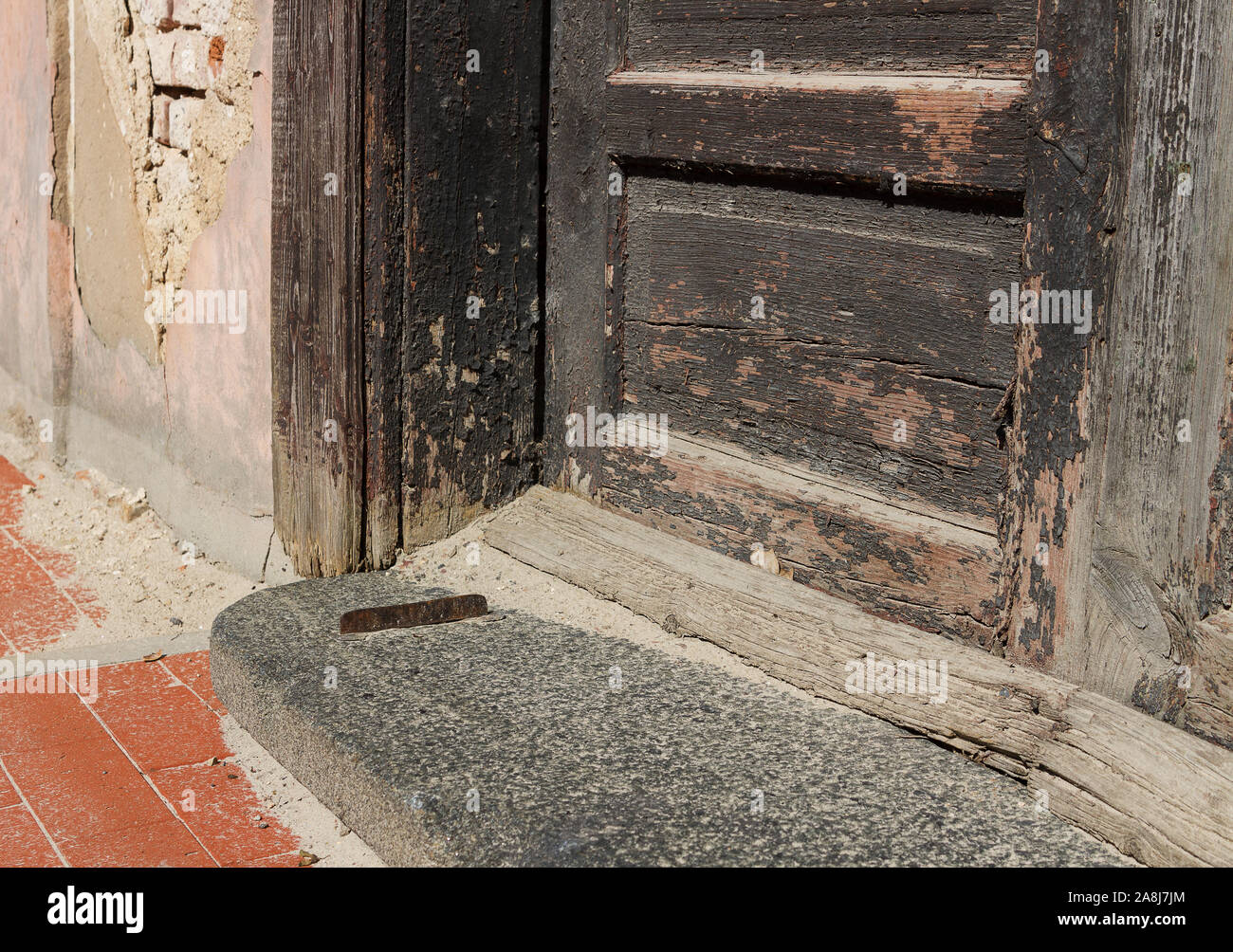 Old stone threshold with metal detail Stock Photo - Alamy