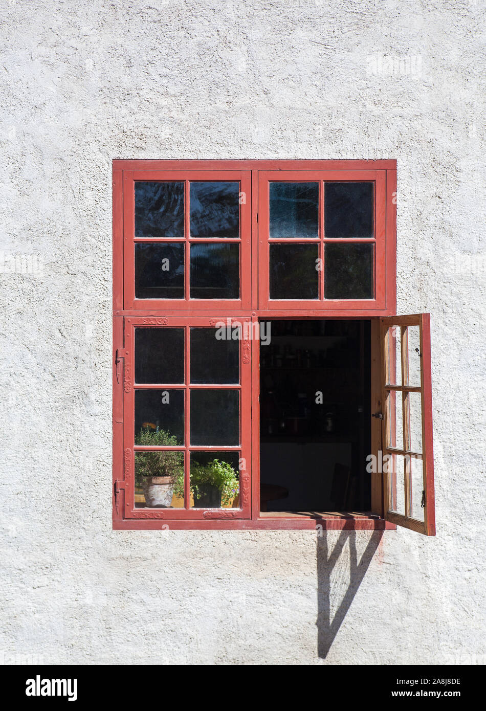 Red opened window on white wall surface Stock Photo - Alamy