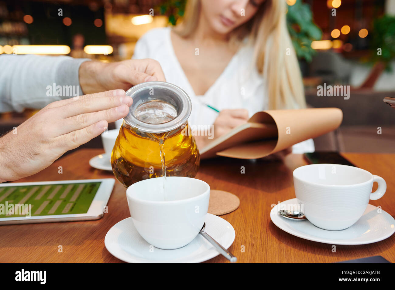 Herbal tea hands table hi-res stock photography and images - Alamy