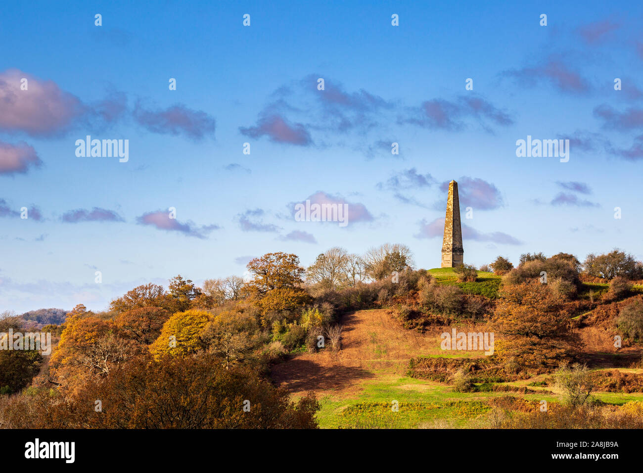 An autumn view of Eastnor castle Obelisk in the Malvern Hills, England ...