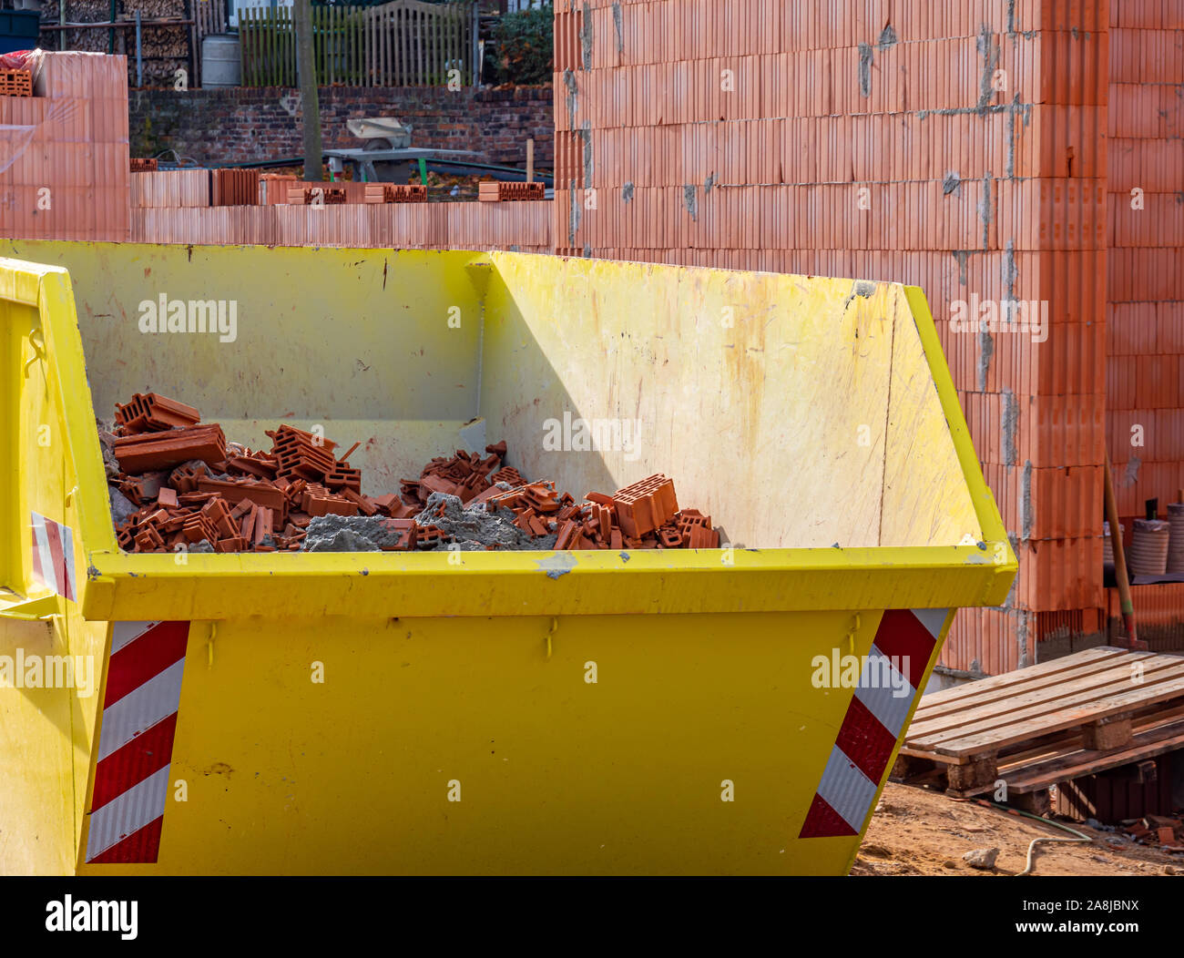 Construction container with rubble from the shell Stock Photo - Alamy