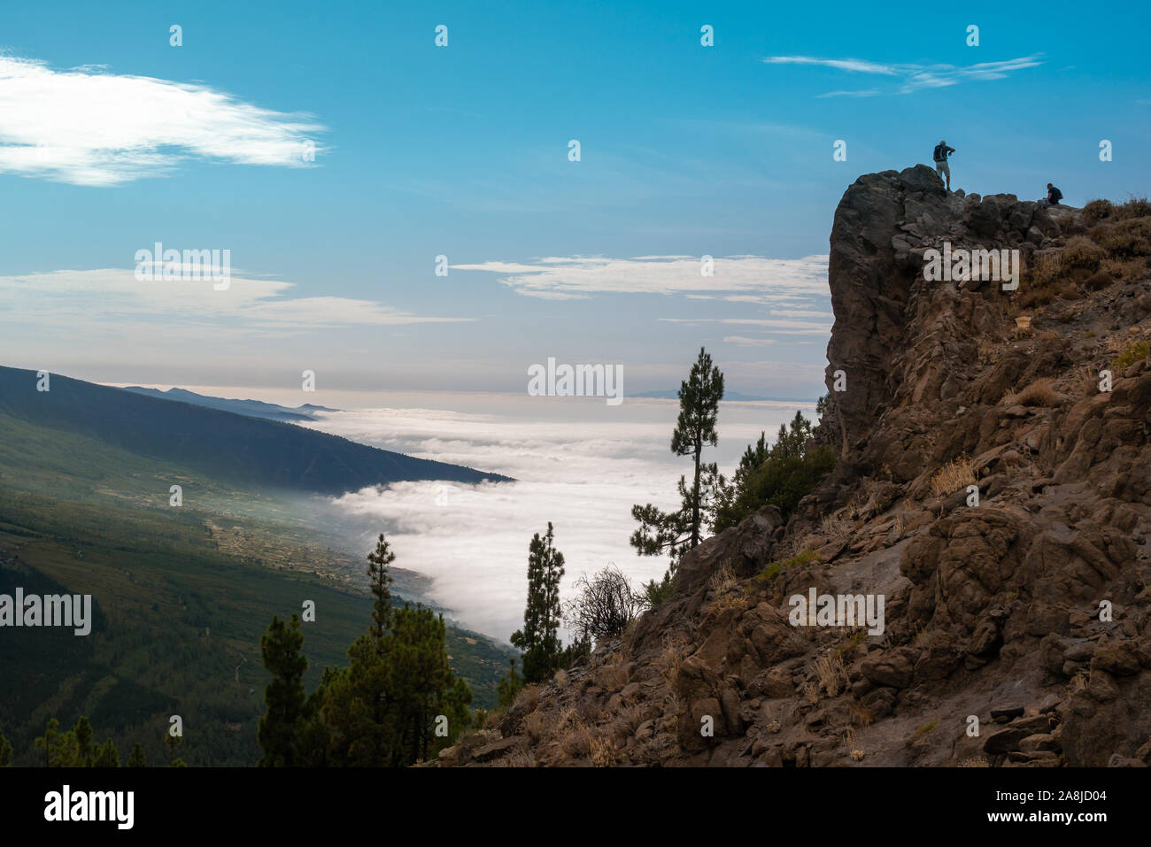 hikers from the top look at the landscape Stock Photo - Alamy