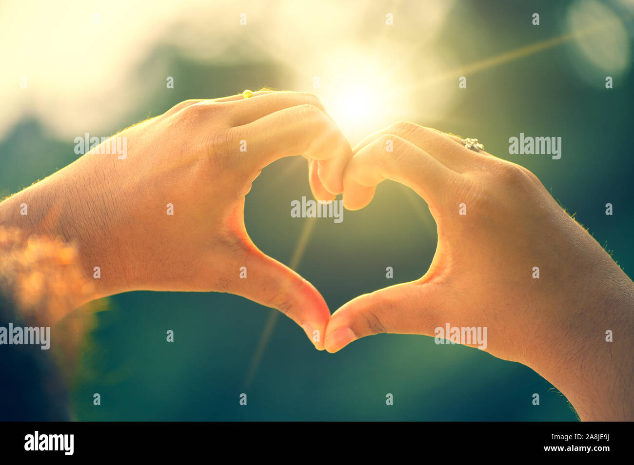 Sun hands heart hi-res stock photography and images - Alamy