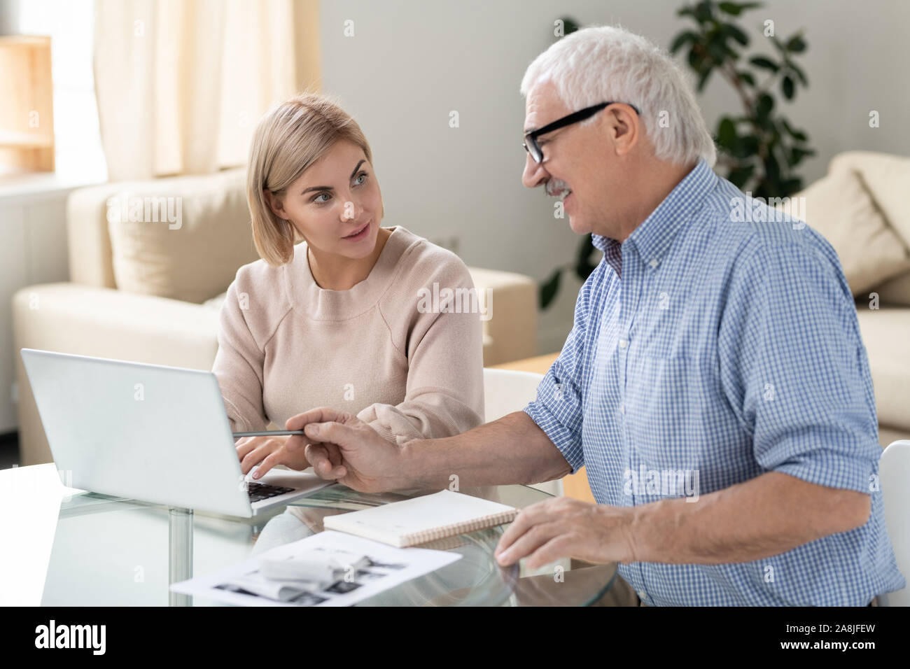 Adult talking laptop home desk hi-res stock photography and images - Alamy