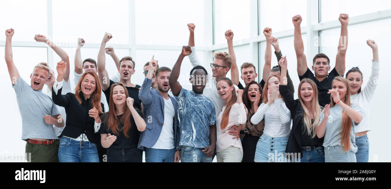 team of happy young people showing their success Stock Photo - Alamy