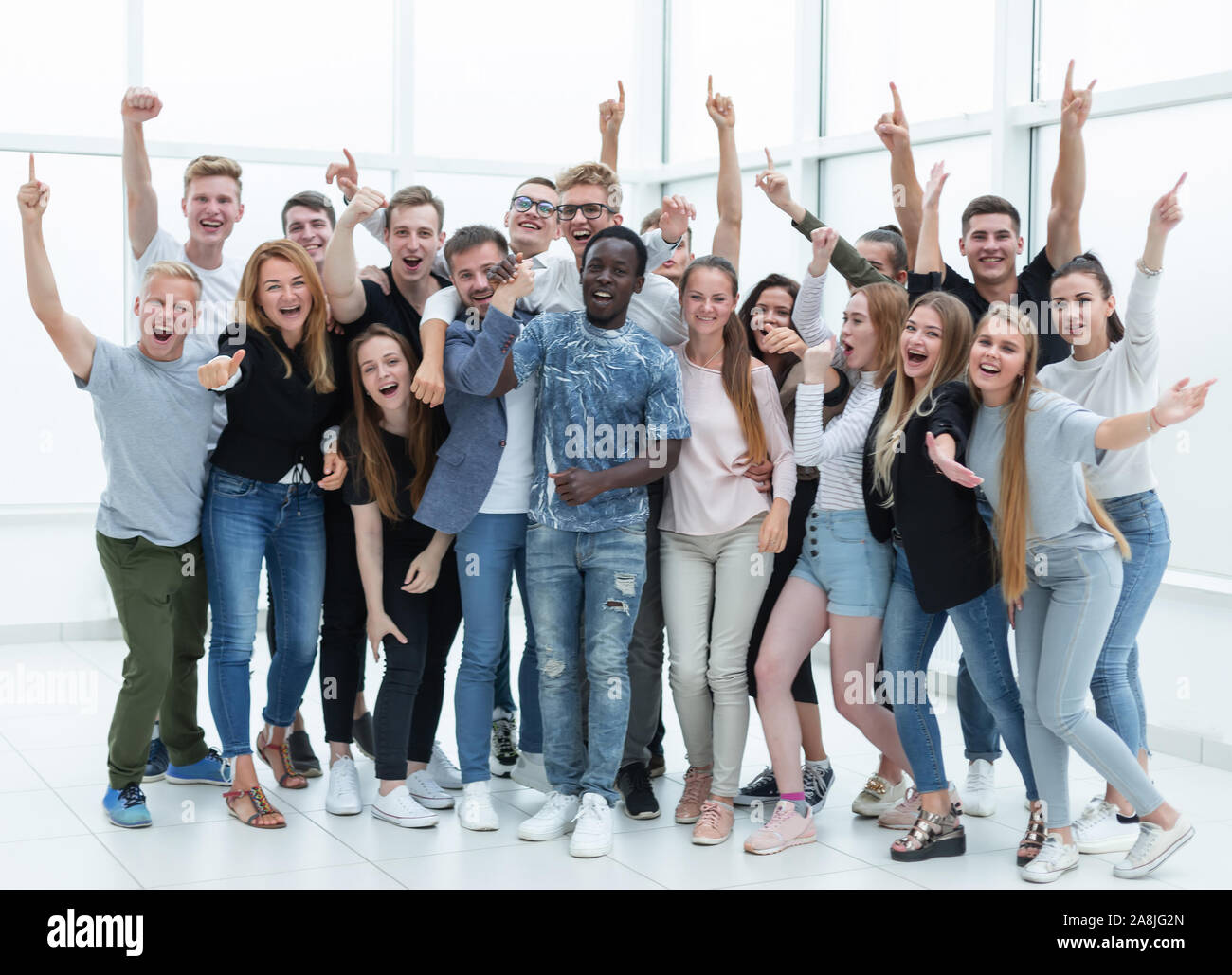 team of happy young people showing their success Stock Photo - Alamy