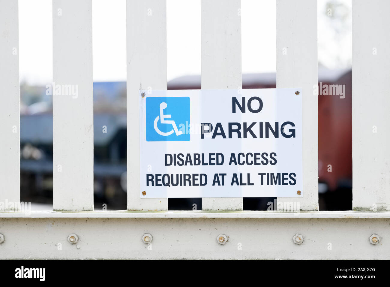 Disabled access no parking sign on private gate Stock Photo - Alamy