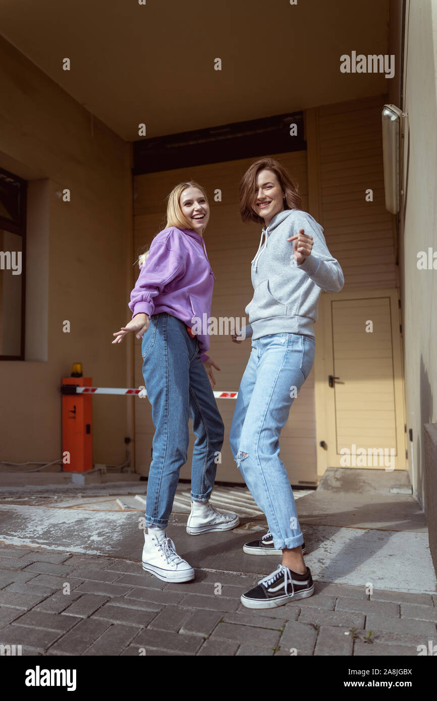 Joyful young models looking straight at camera Stock Photo - Alamy