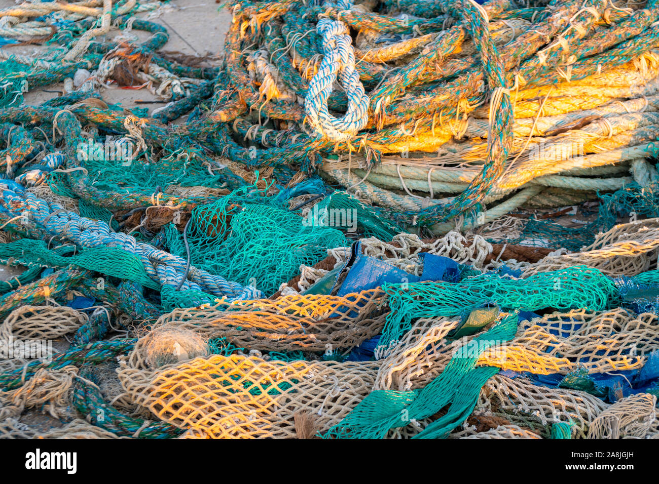 dirty old rope and nets for fishing on the dock Fiumicino Stock Photo ...