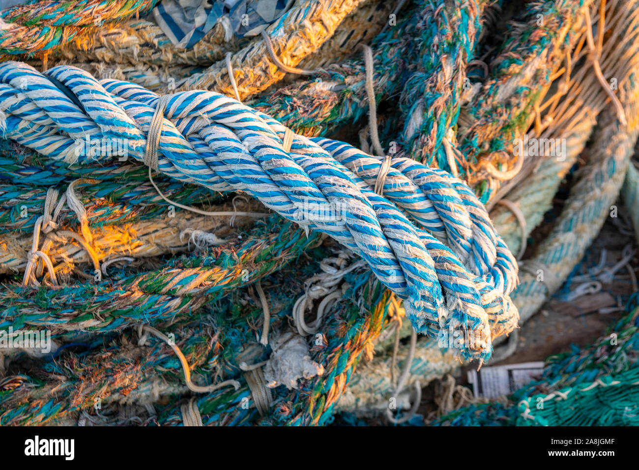 dirty old rope and nets for fishing on the dock Fiumicino Stock Photo ...