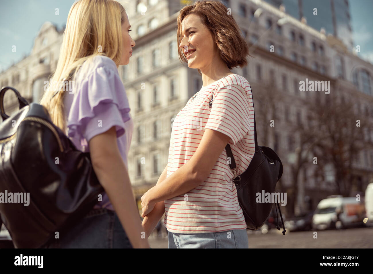 Cute girls waiting for their touristic group Stock Photo - Alamy