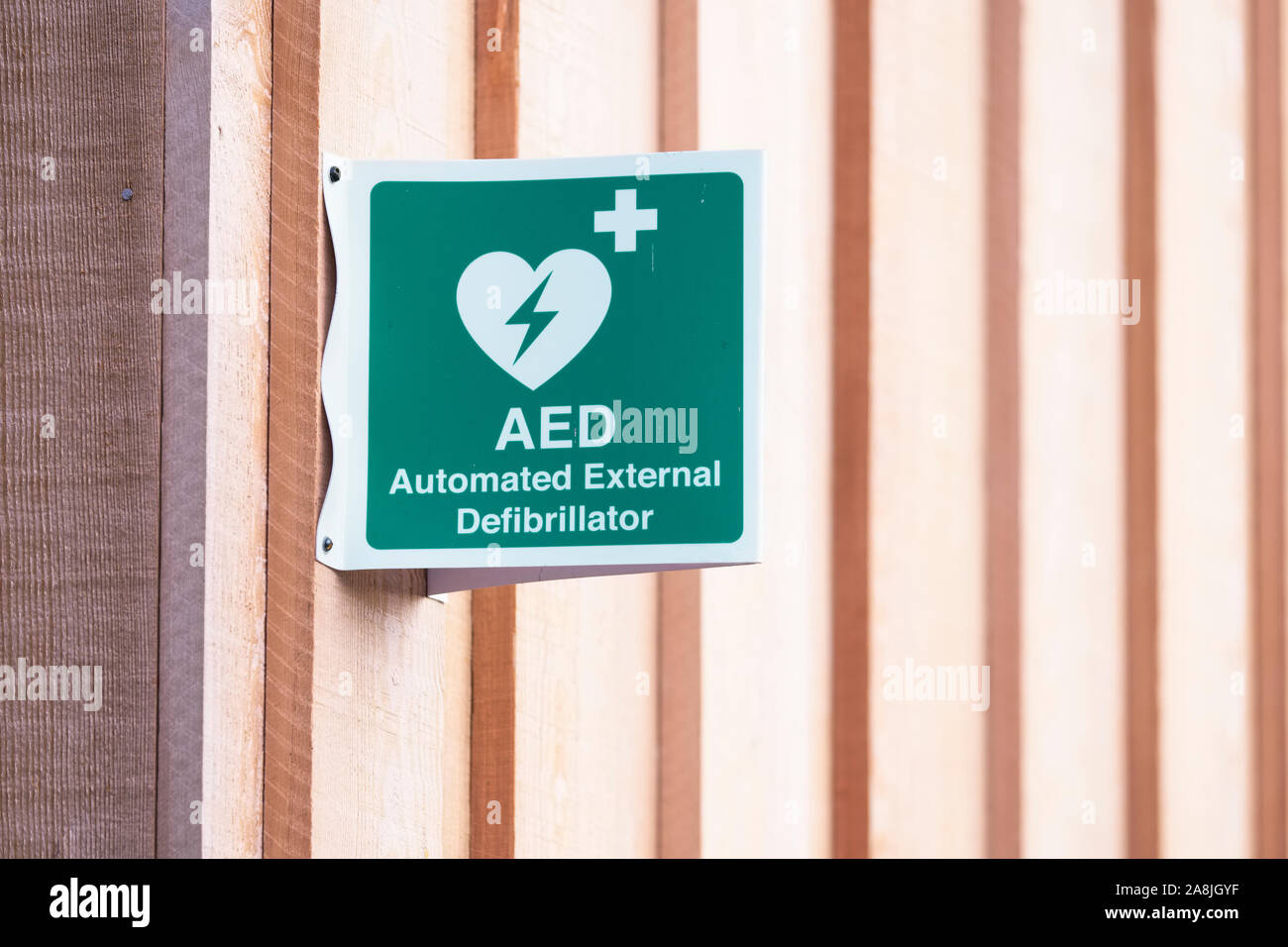 Defibrillator AED sign and symbol on wall Stock Photo - Alamy