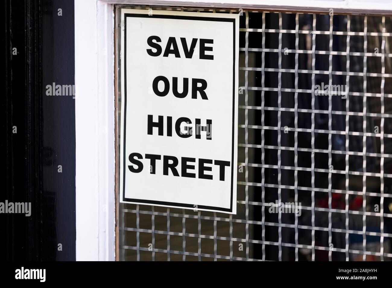 Save our high street sign on closed shop window due to online shopping ...