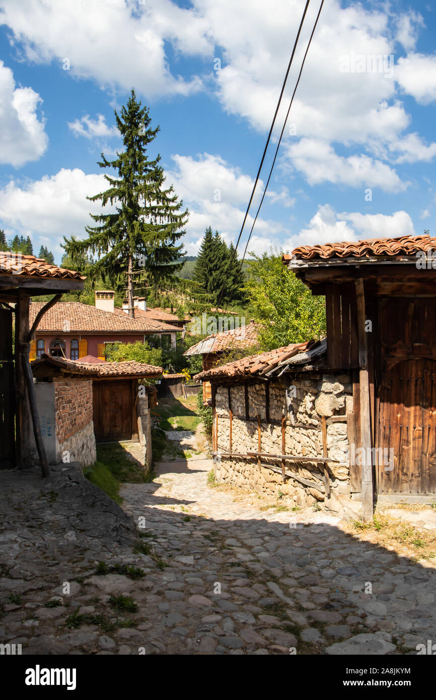 View over houses in the street of a town Stock Photo - Alamy