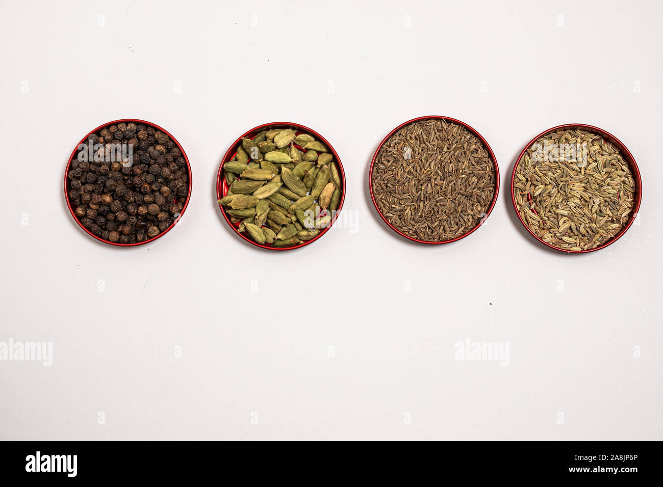 Composition with different spices, Cardamom. black pepper. Spherical ...