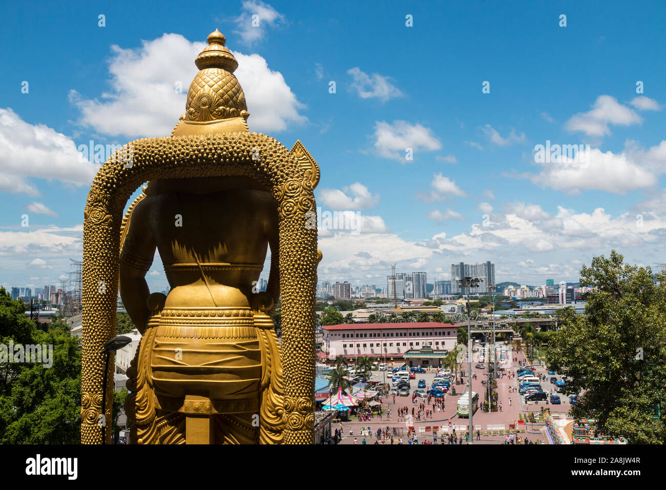 KUALA LUMPUR / MALAYSIA - May 12, 2019: Tourists ascend the colorful ...