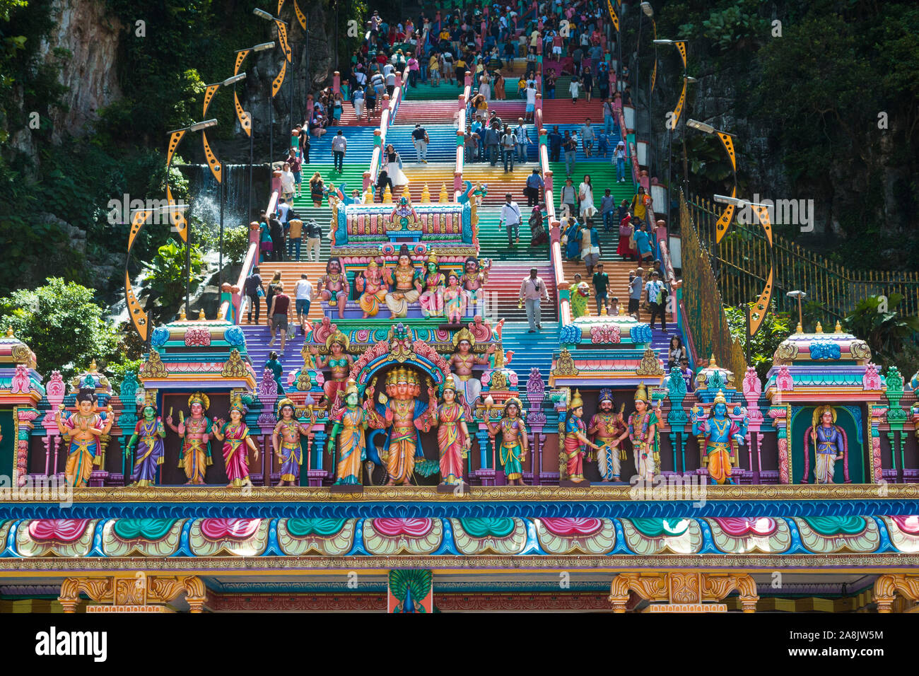 KUALA LUMPUR / MALAYSIA - May 12, 2019: Tourists ascend the colorful ...