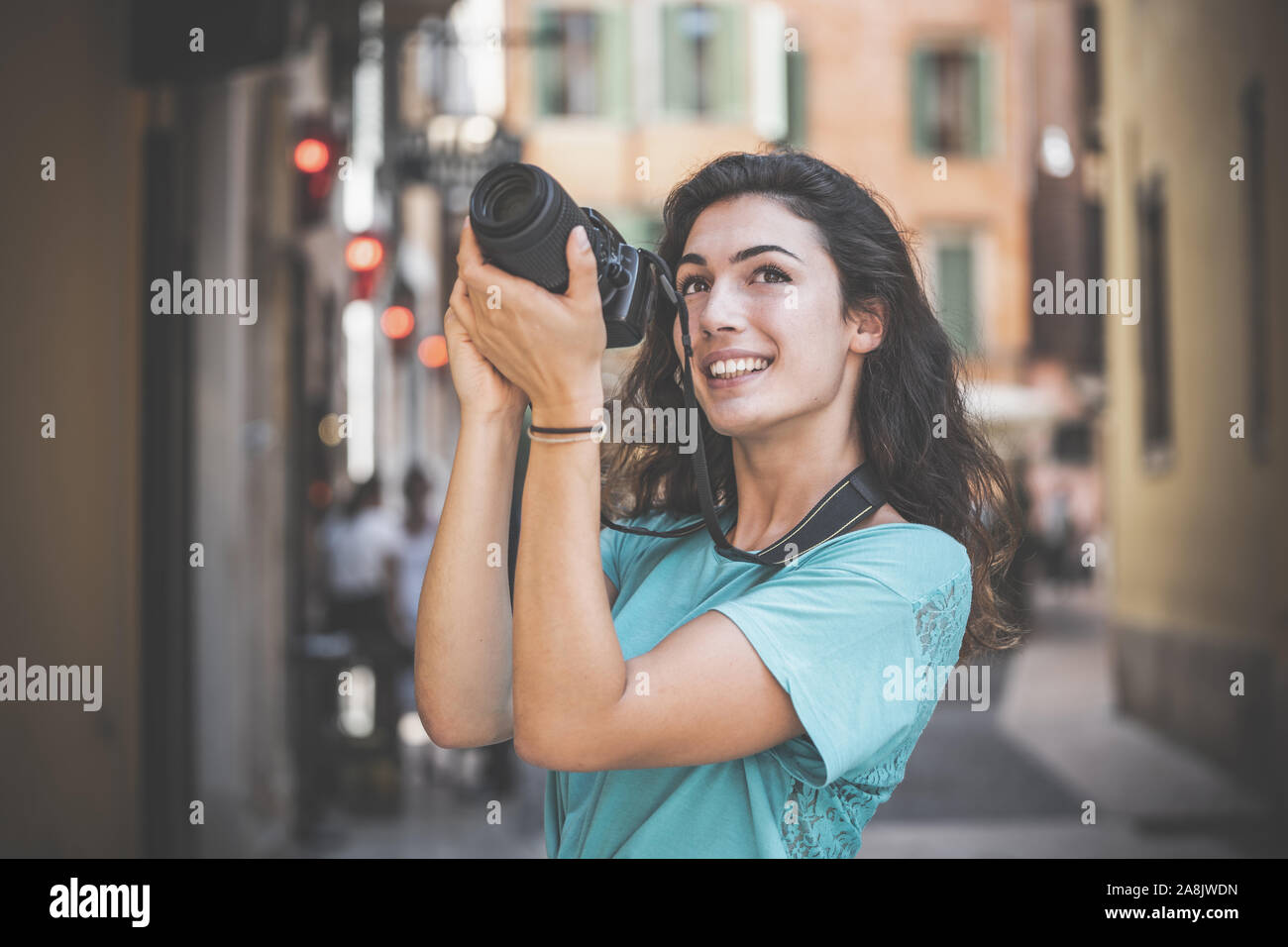 Girl tourist or professional photographer who shoots in a typical ...