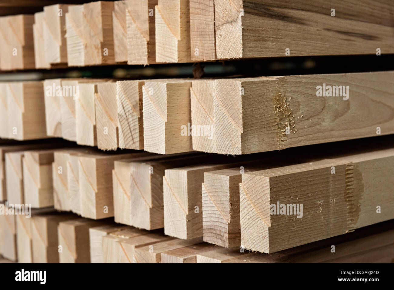 End view of stacked lumber. Wooden structure closeup Stock Photo - Alamy
