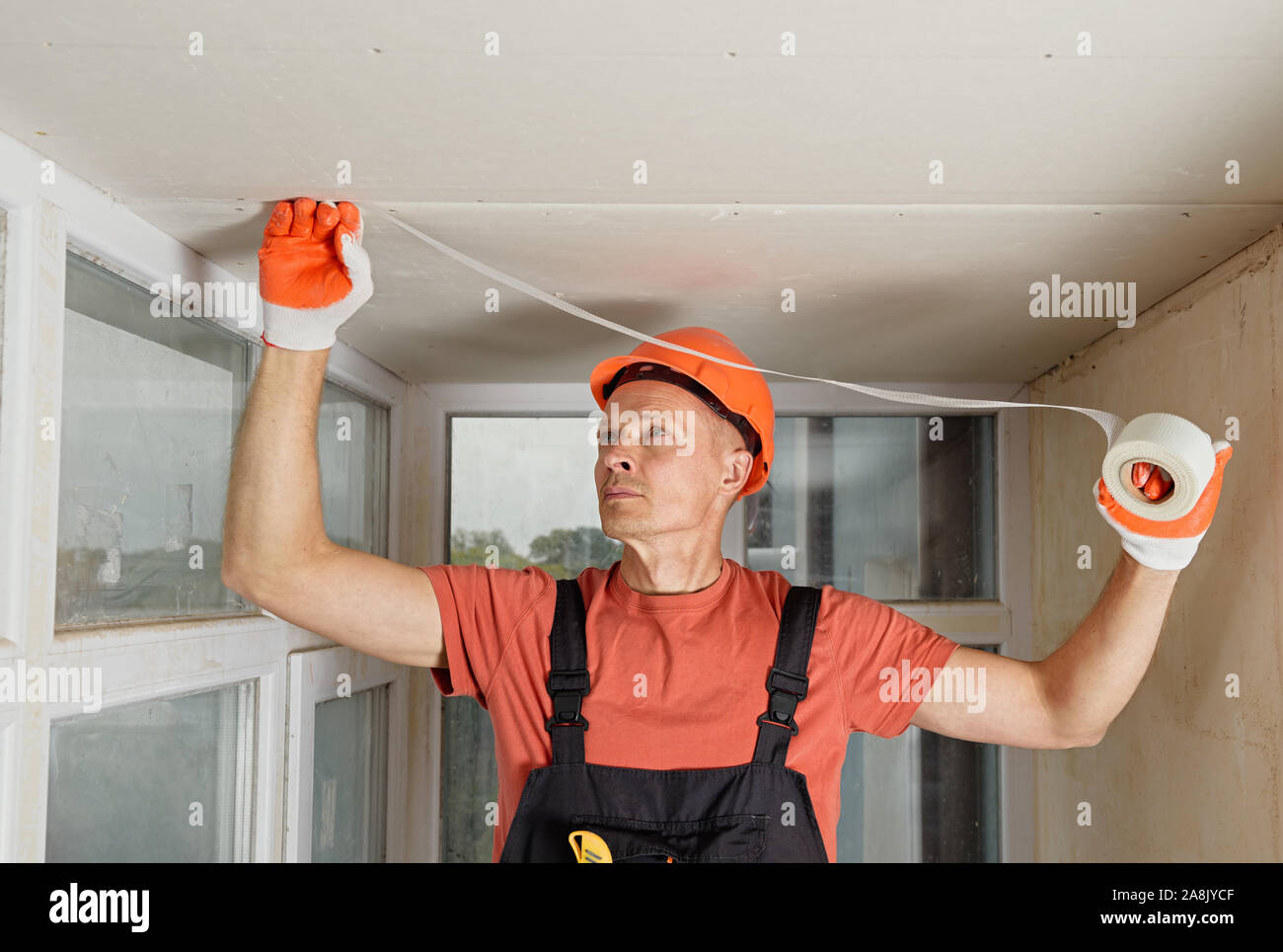 Installing fiberglass insulation hi-res stock photography and images ...