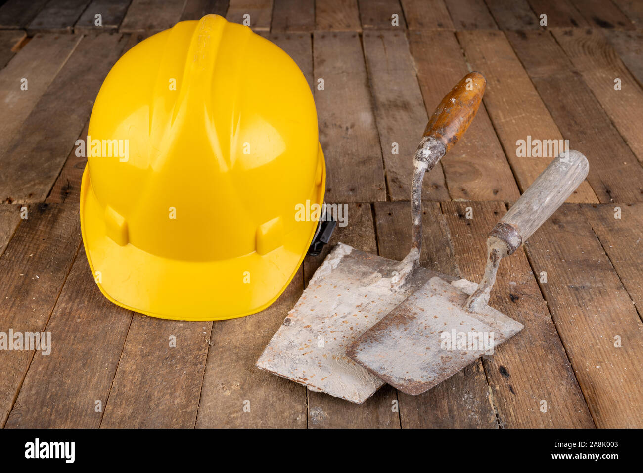 Protective helmet and tools for bricklayer. Work accessories for ...