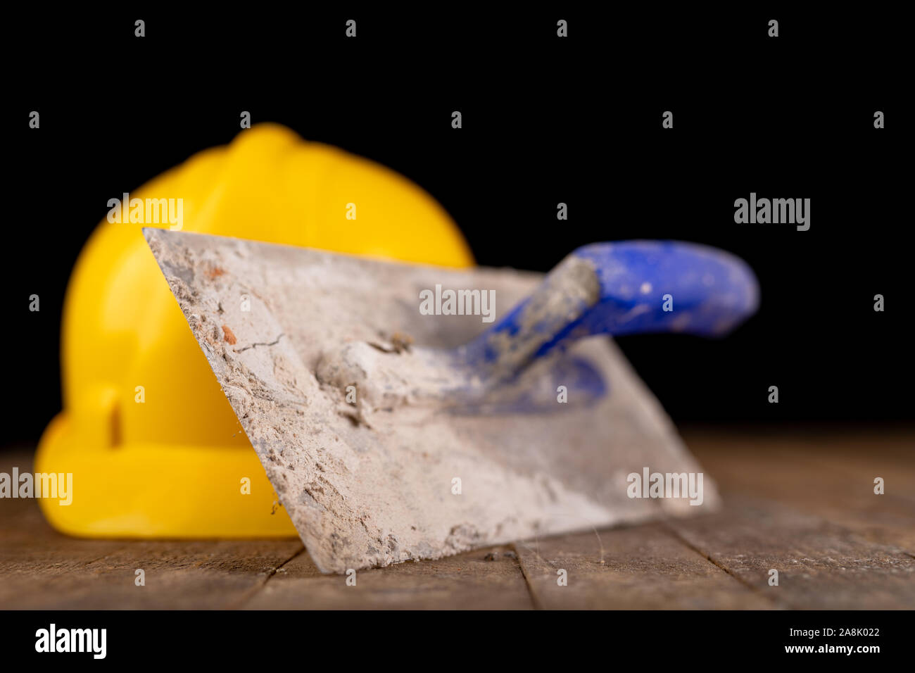 Protective helmet and tools for bricklayer. Work accessories for ...