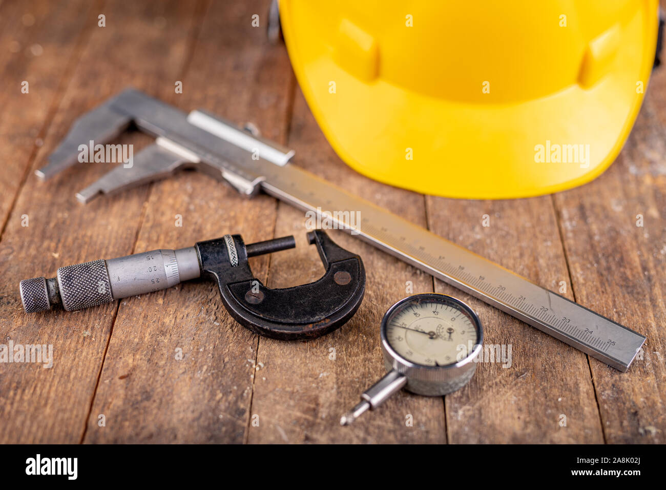Protective helmet and measuring tools. Work accessories for production ...